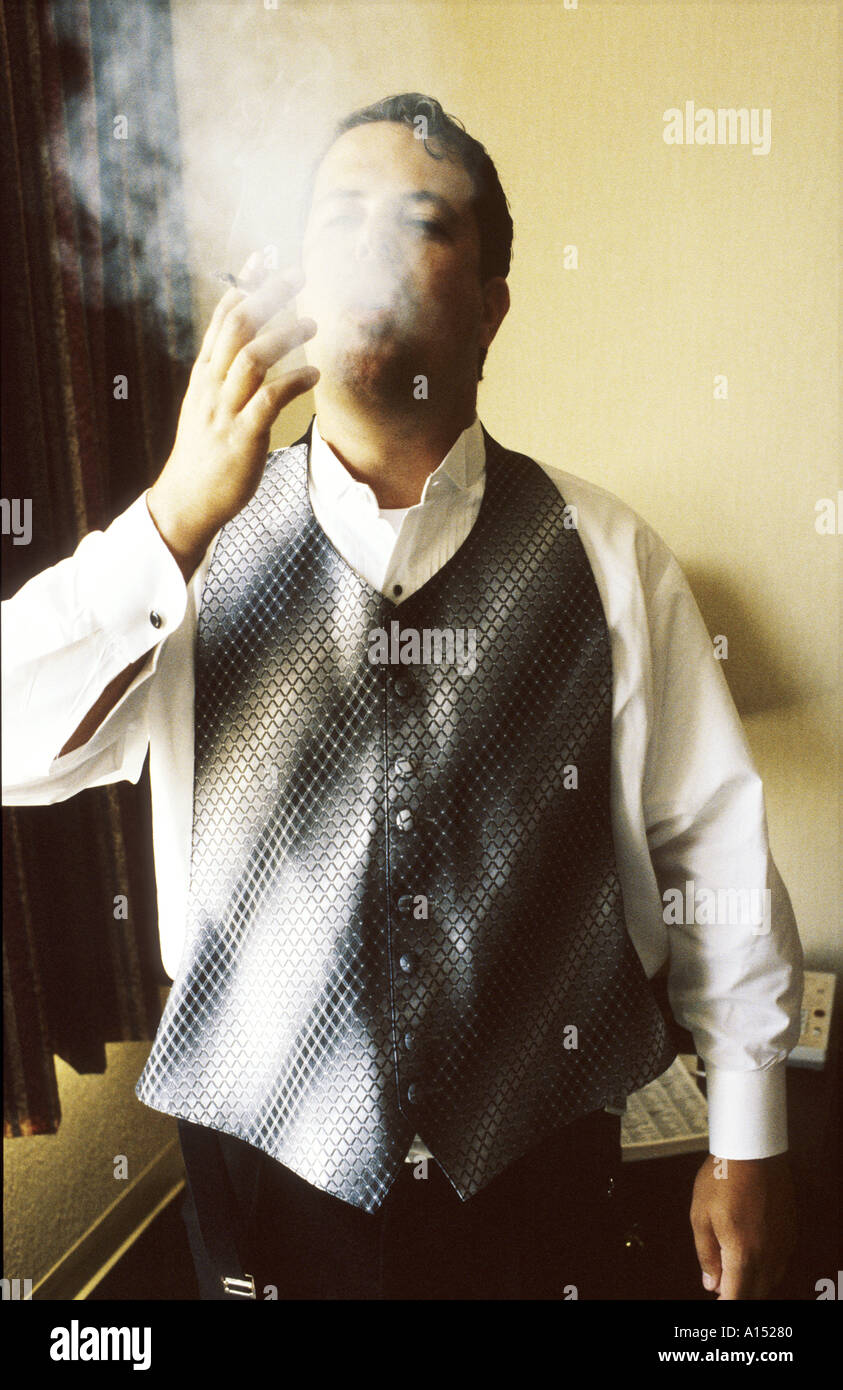 portrait of young groom smoking before wedding Stock Photo - Alamy