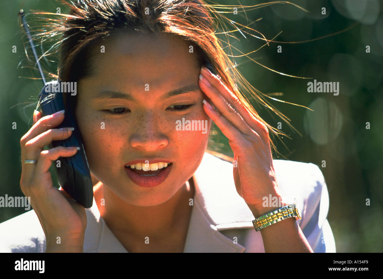 Asian woman outdoors talking hi-res stock photography and images - Alamy