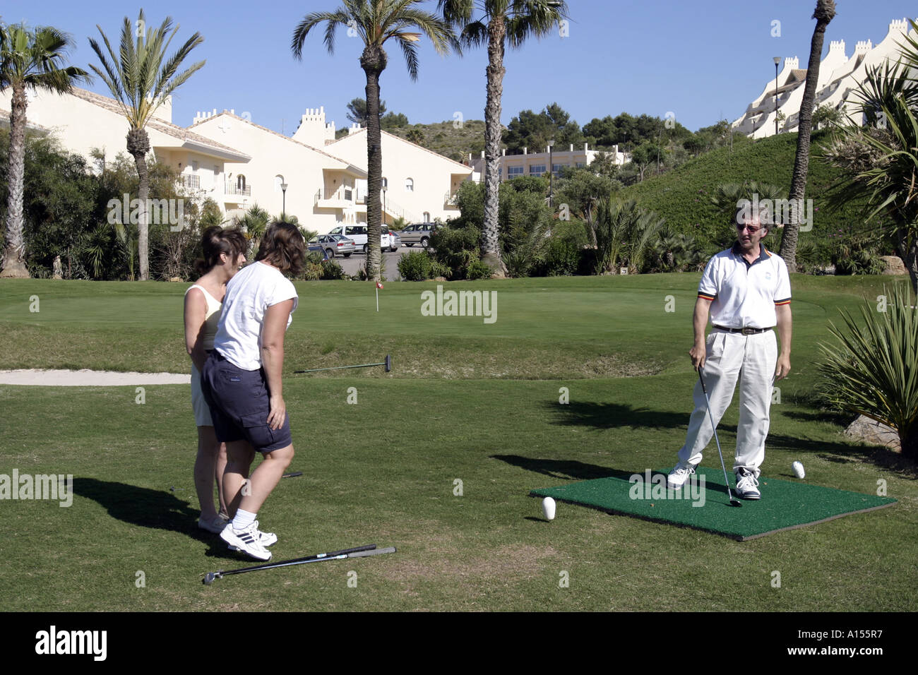 Playing golf under tree hi-res stock photography and images - Alamy
