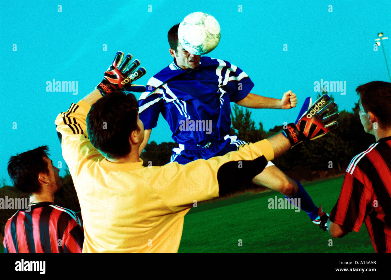 soccer Young men playing football Stock Photo - Alamy