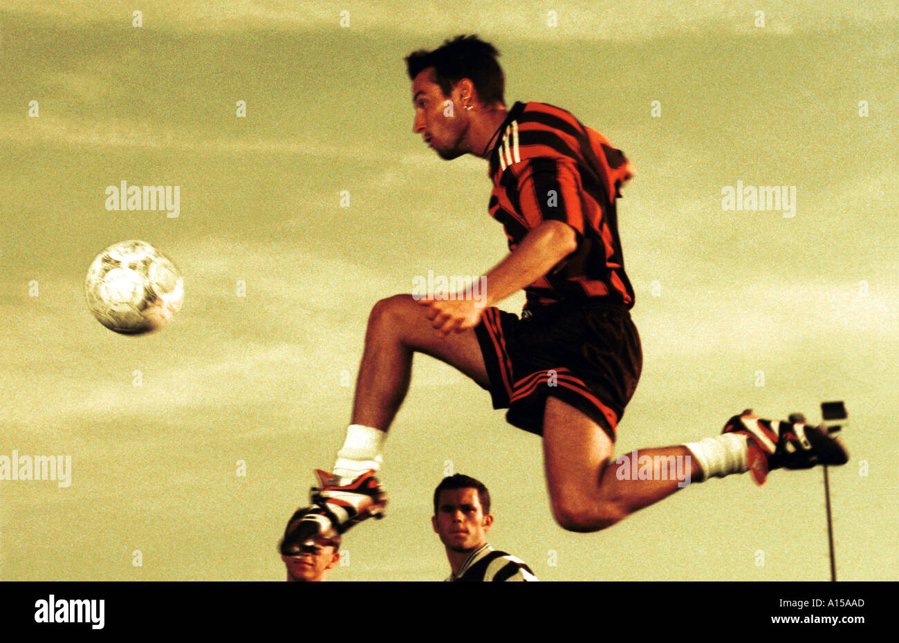 soccer young men playing football Stock Photo - Alamy