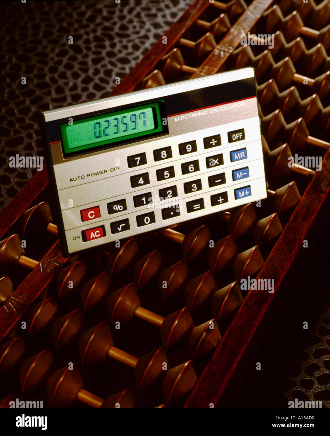 Electronic calculator and old Chinese abacus Stock Photo - Alamy