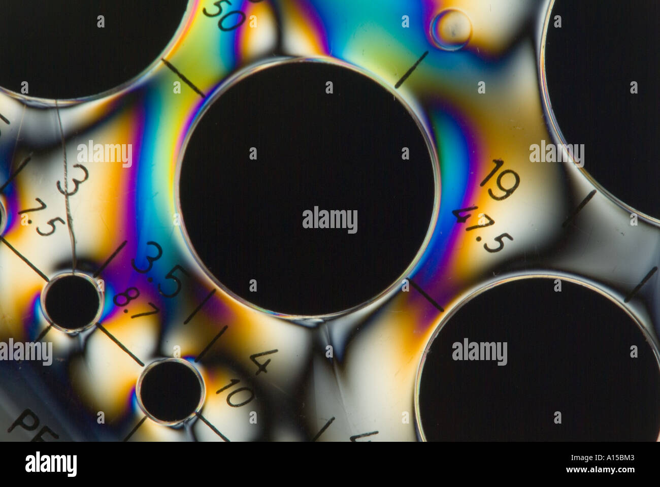 Cross polarised light showing stress patterns in plastic Stock Photo ...