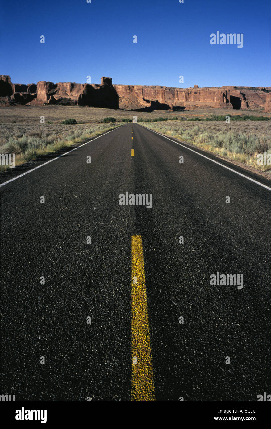 Paved blacktop asphalt road with broken yellow center line Arches ...