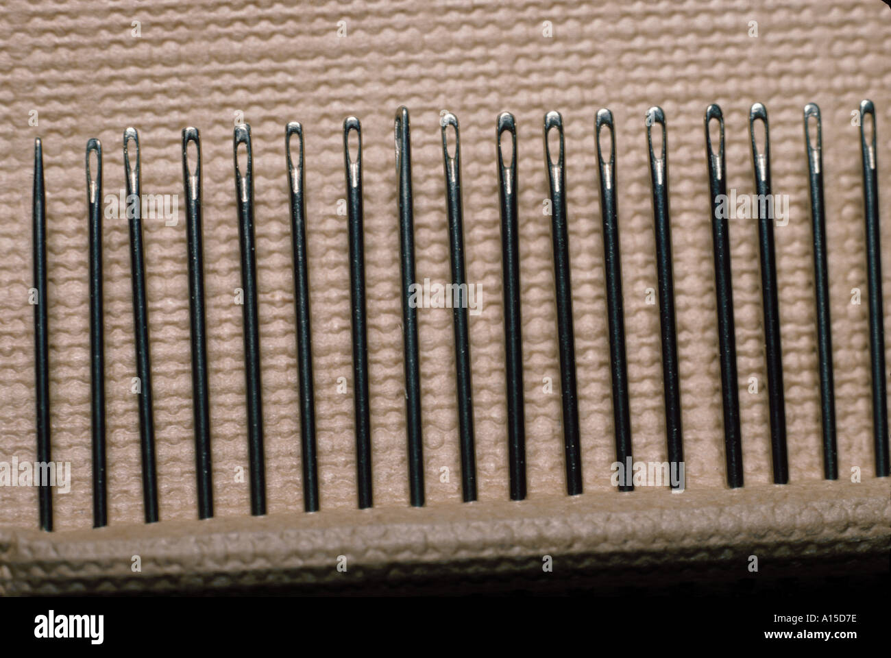 sewing needles in a row Stock Photo - Alamy