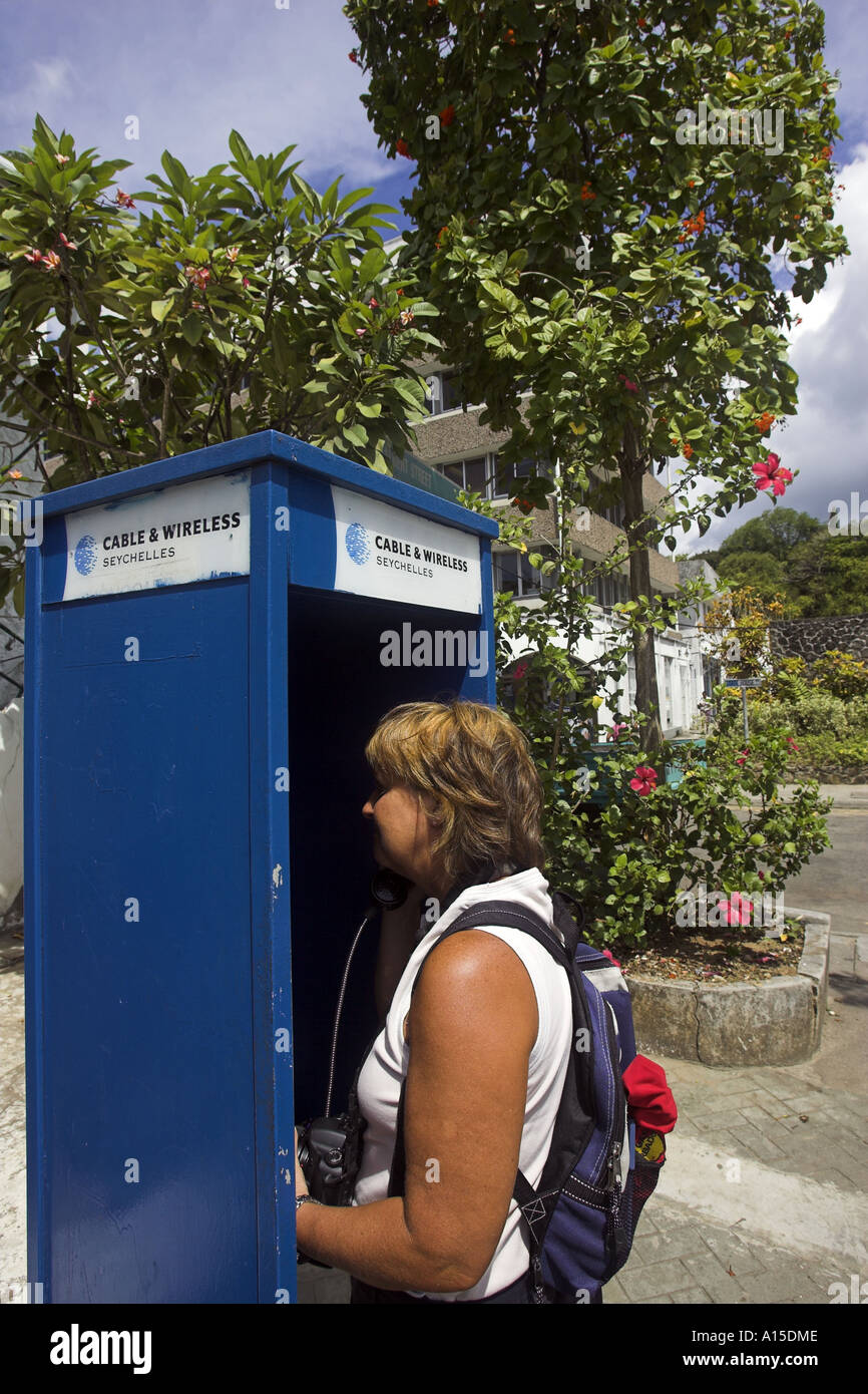 Woman at a public telephone call box Stock Photo - Alamy