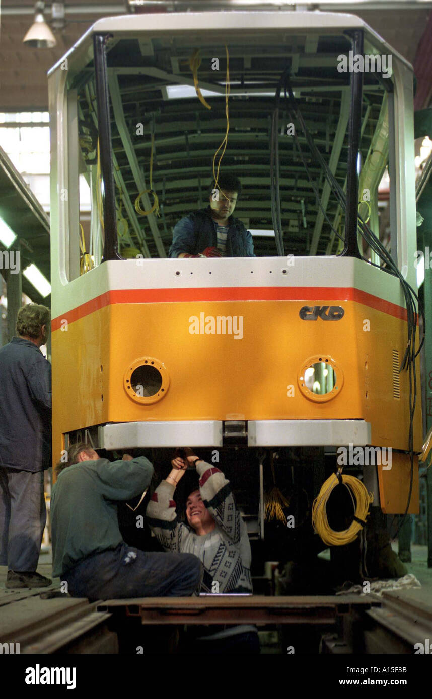 Workers prepare a tram at the CKD tram and train factory in Prague ...