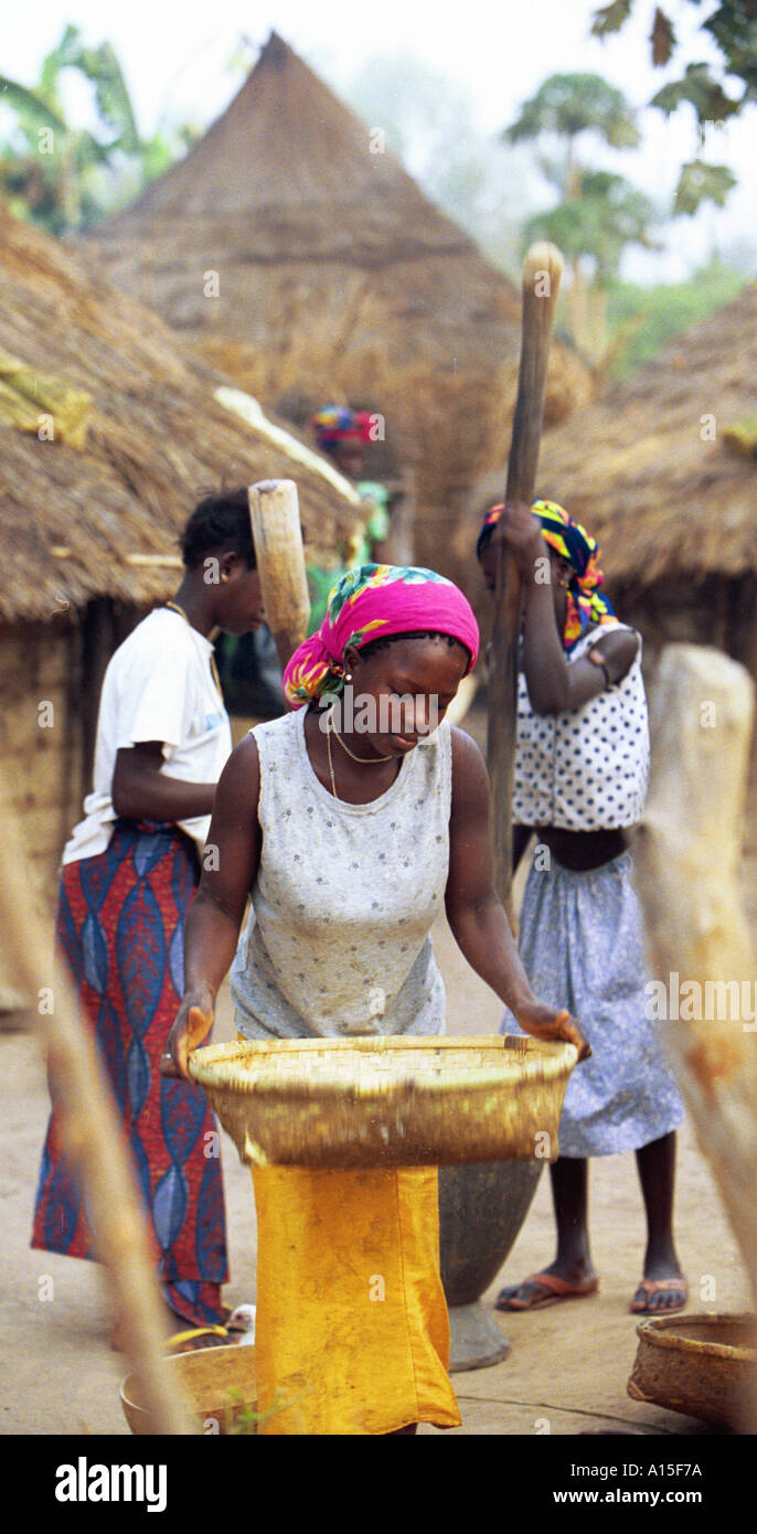Young girls prepares rice in the Muslim Fulani village of Dembel ...