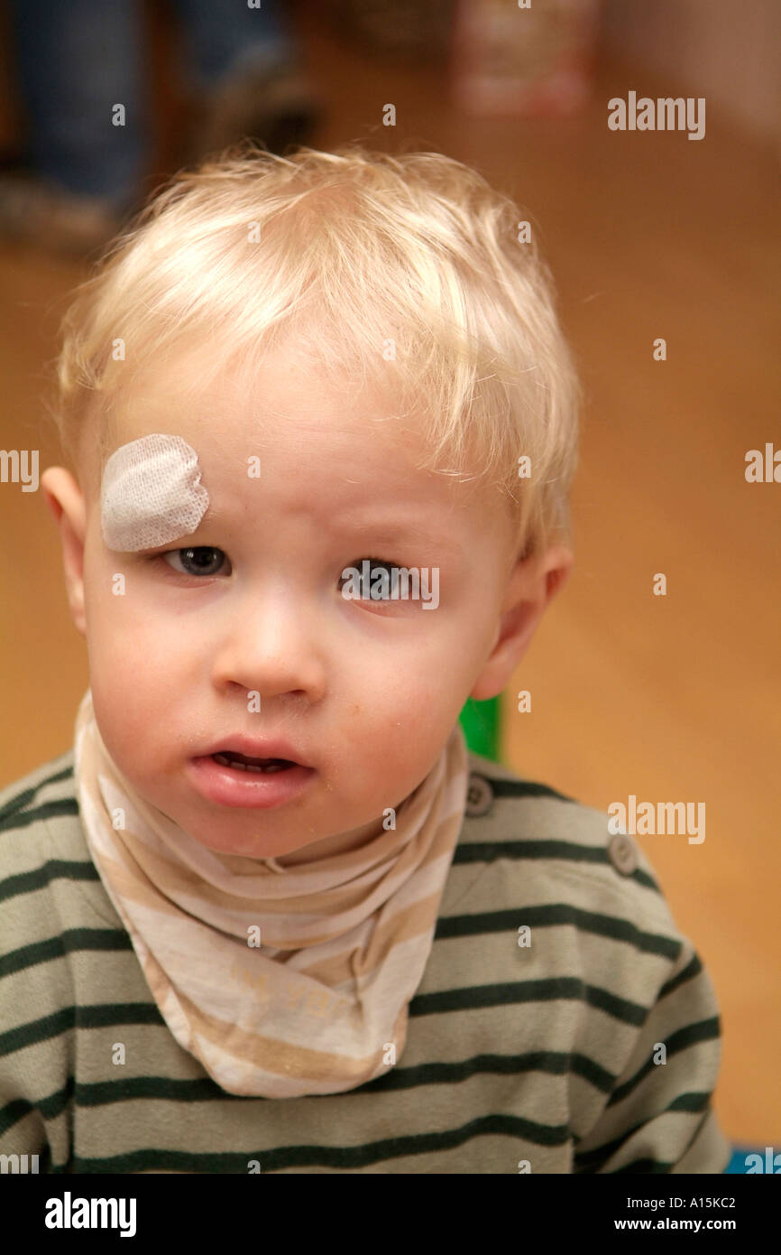 hurt child with band aid Stock Photo - Alamy