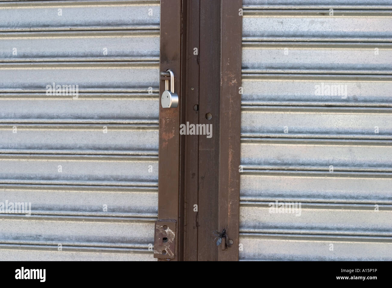 Lock on roll down gate Stock Photo - Alamy
