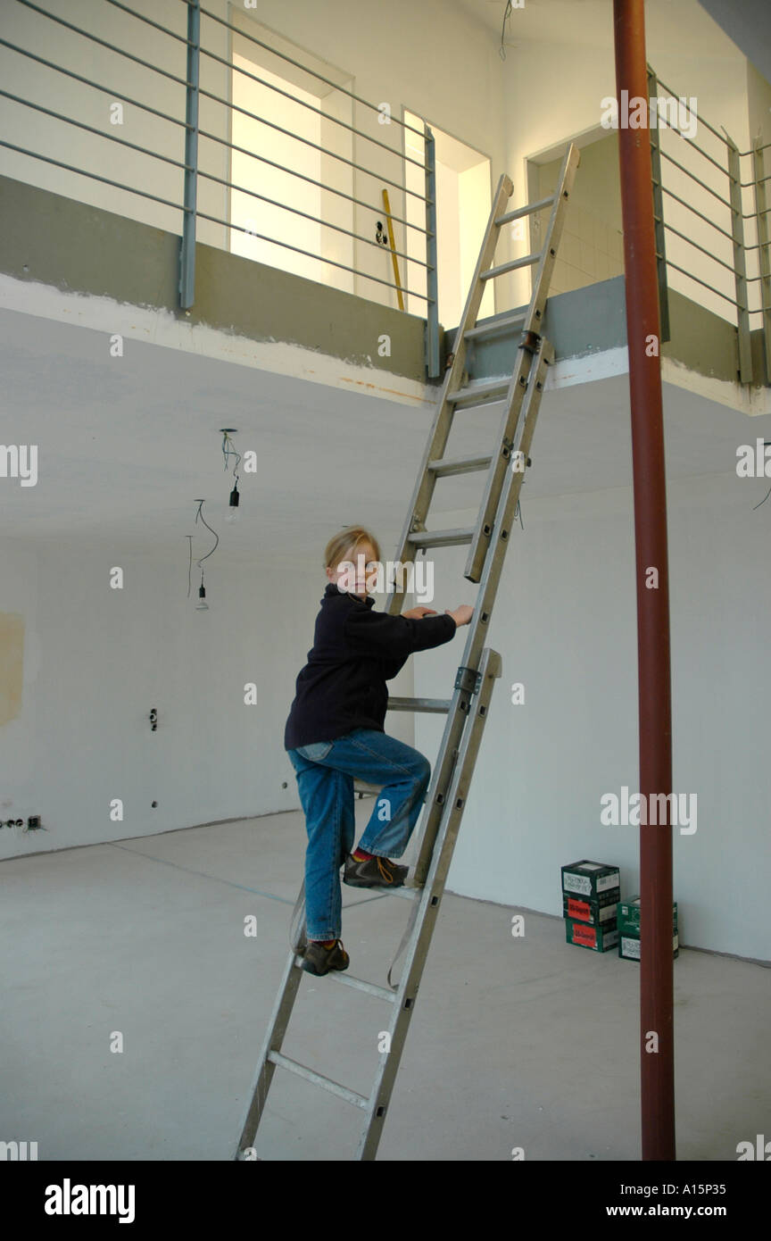 child climbing on a ladder in a newly built house Stock Photo - Alamy