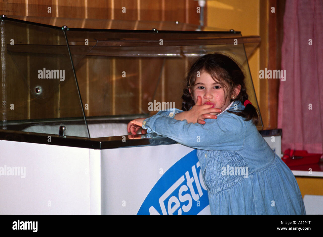 Young girl stealing ice cream with fingers Stock Photo - Alamy