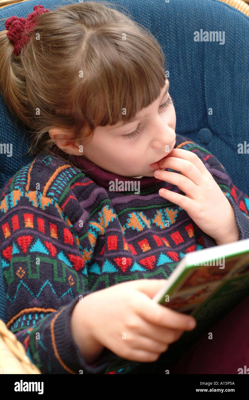 Child chewing hands hi-res stock photography and images - Alamy