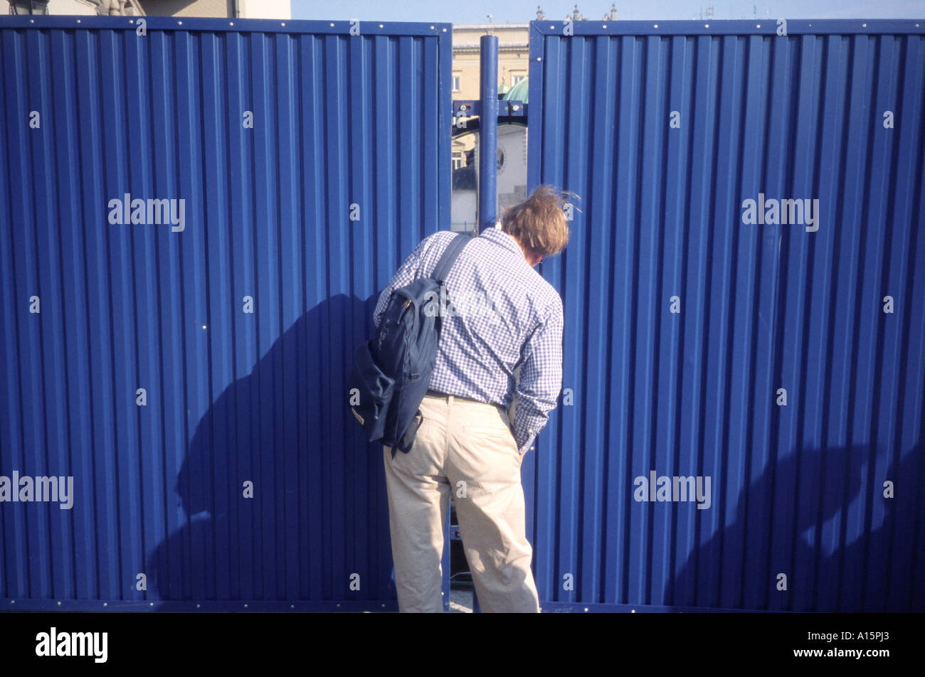 Man peeping fence hi-res stock photography and images - Alamy