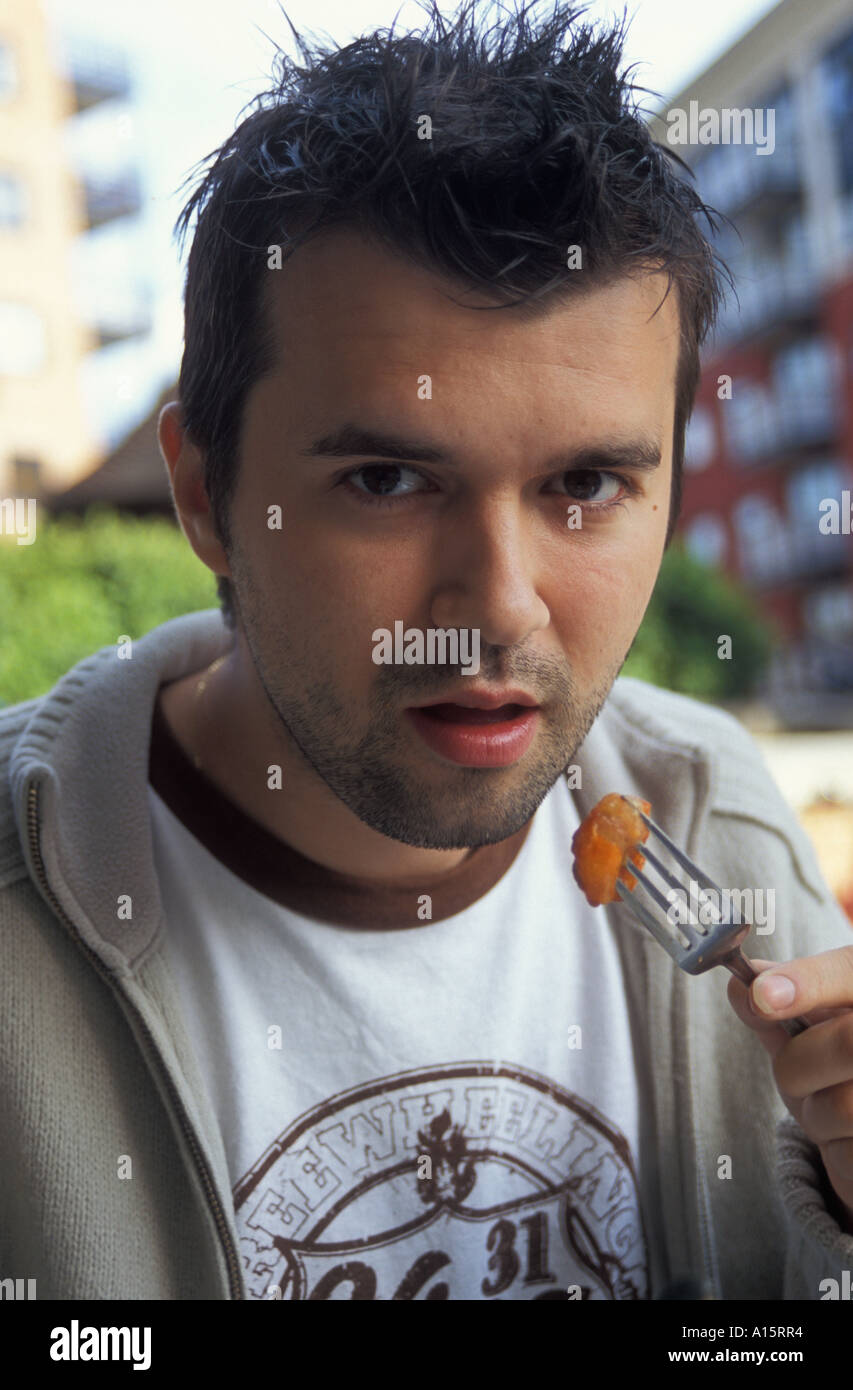 Handsome man eating beard fork hi-res stock photography and images - Alamy