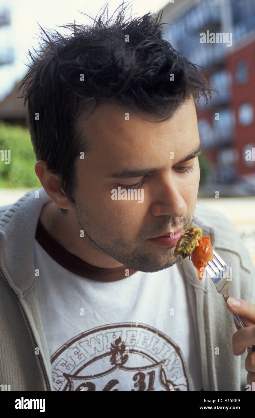 Man tasting fork hi-res stock photography and images - Alamy