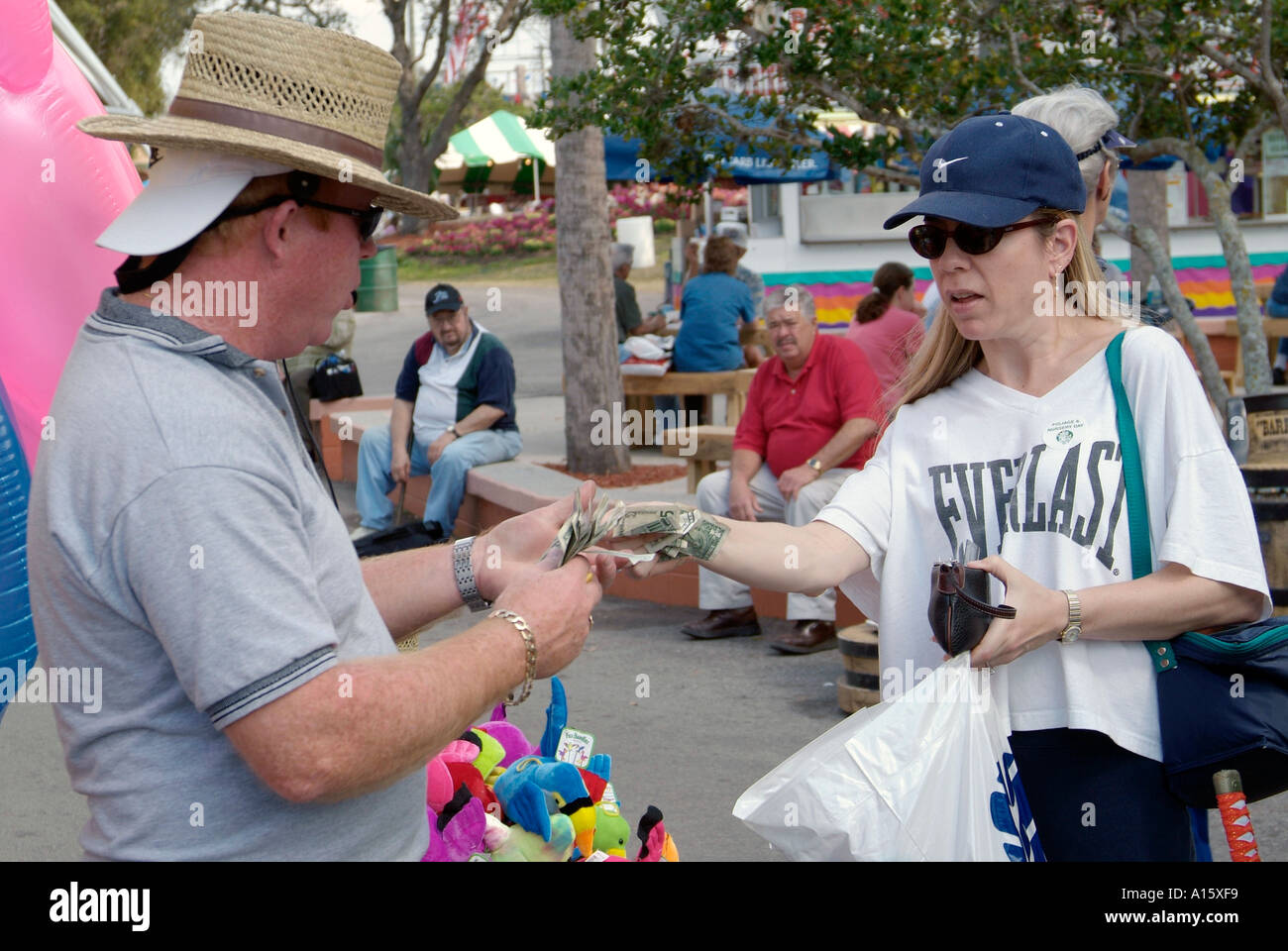 Cash money changing hands between a buyer and seller Stock Photo - Alamy