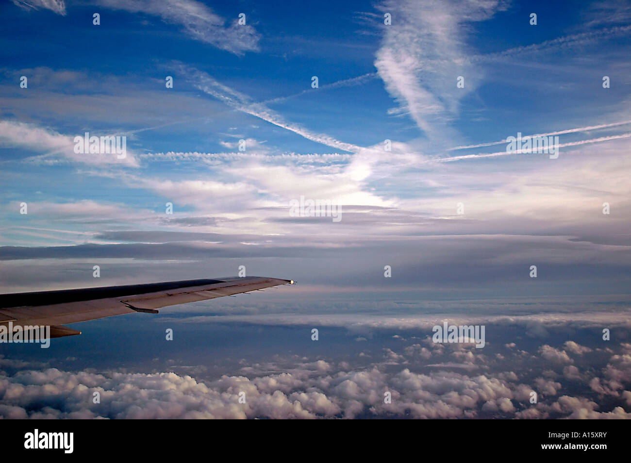 Horizontal aerial view from an aeroplane window of the blue sky with ...