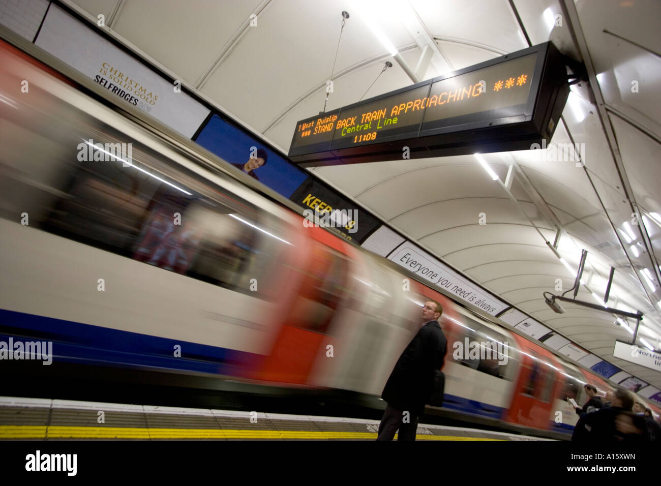 London Underground tube train speeding into Station with led departure ...