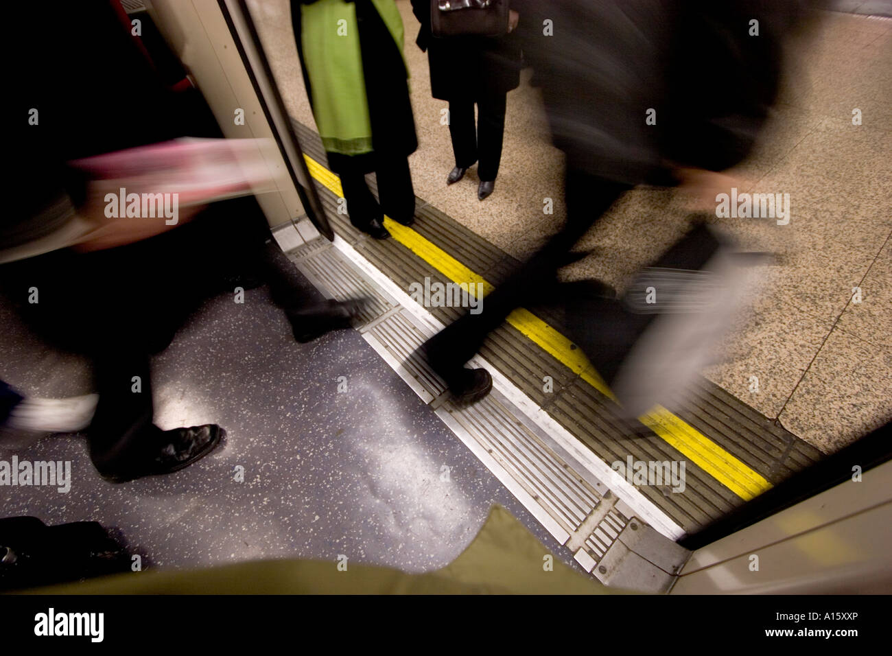 London Underground tube train passengers commuters getting off train ...