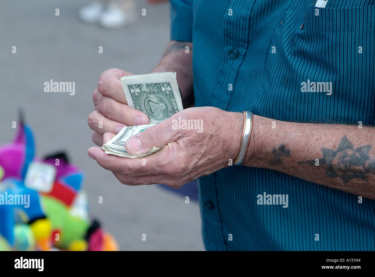Cash money changing hands between a buyer and seller Stock Photo - Alamy