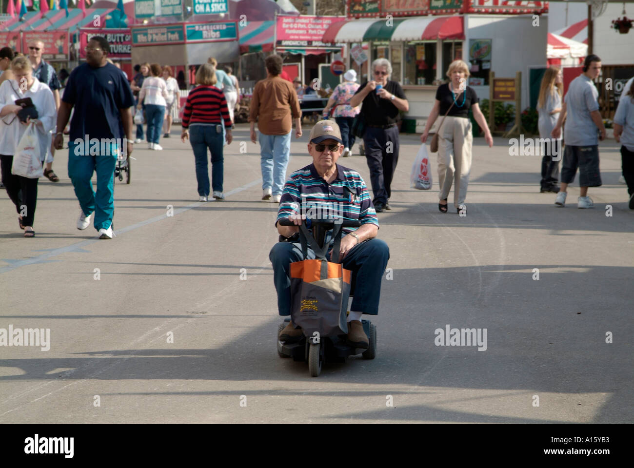 Handicapped person in motorized wheelchair Stock Photo - Alamy