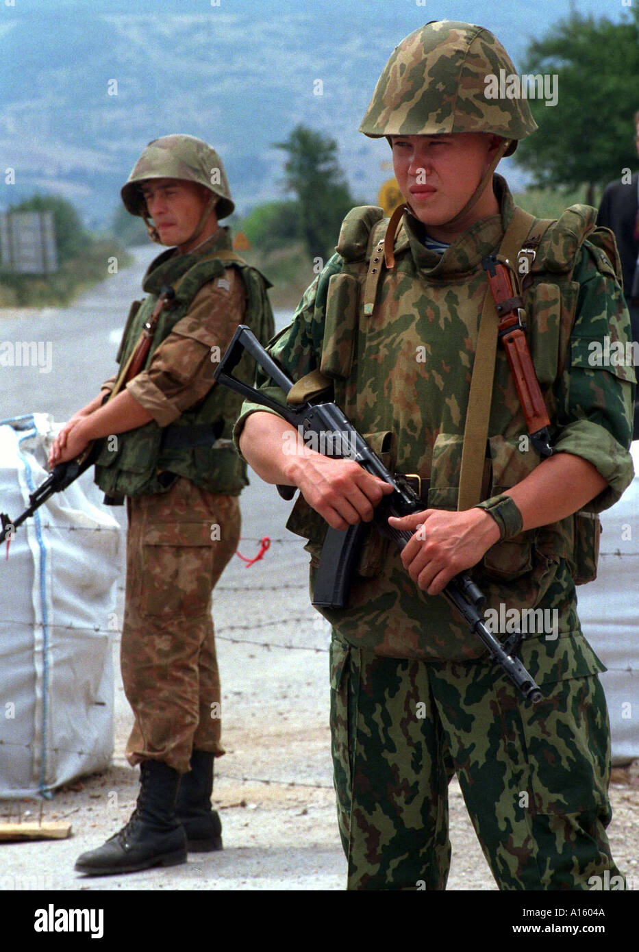 Russian soldiers guard a checkpoint near the village of Pasjane in ...