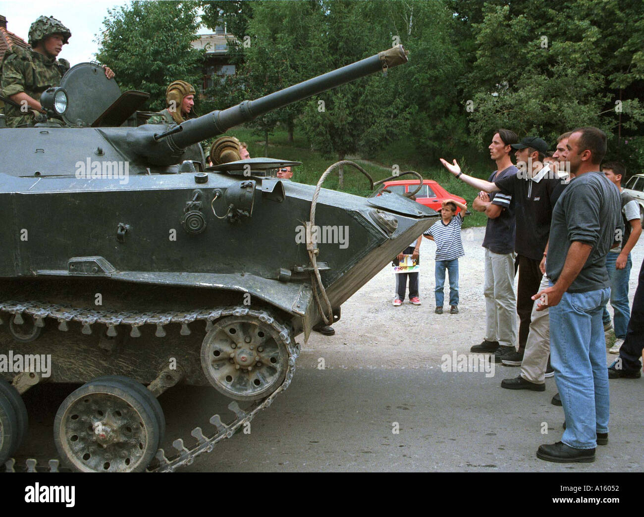 Ethnic Albanians create a roadblock for the Russian troops who were on ...