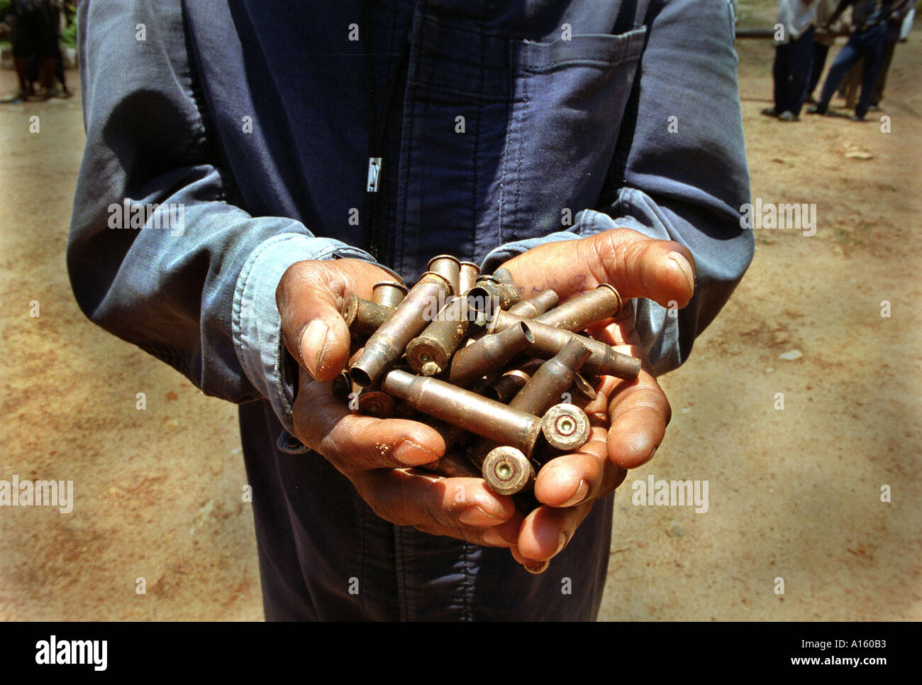 An Angolan child stands in one of the many destroyed buildings in the ...