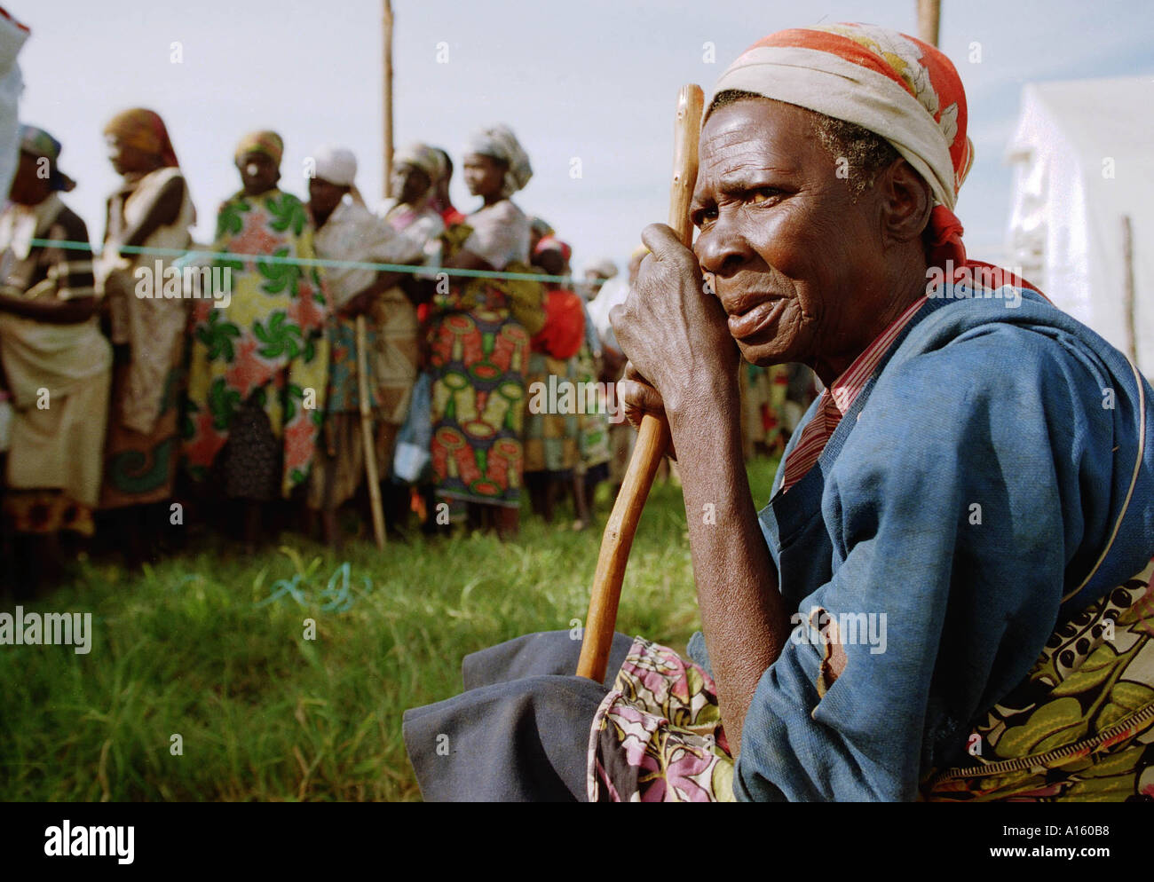 Hundreds of internally displaced people in Angola wait in line to be ...