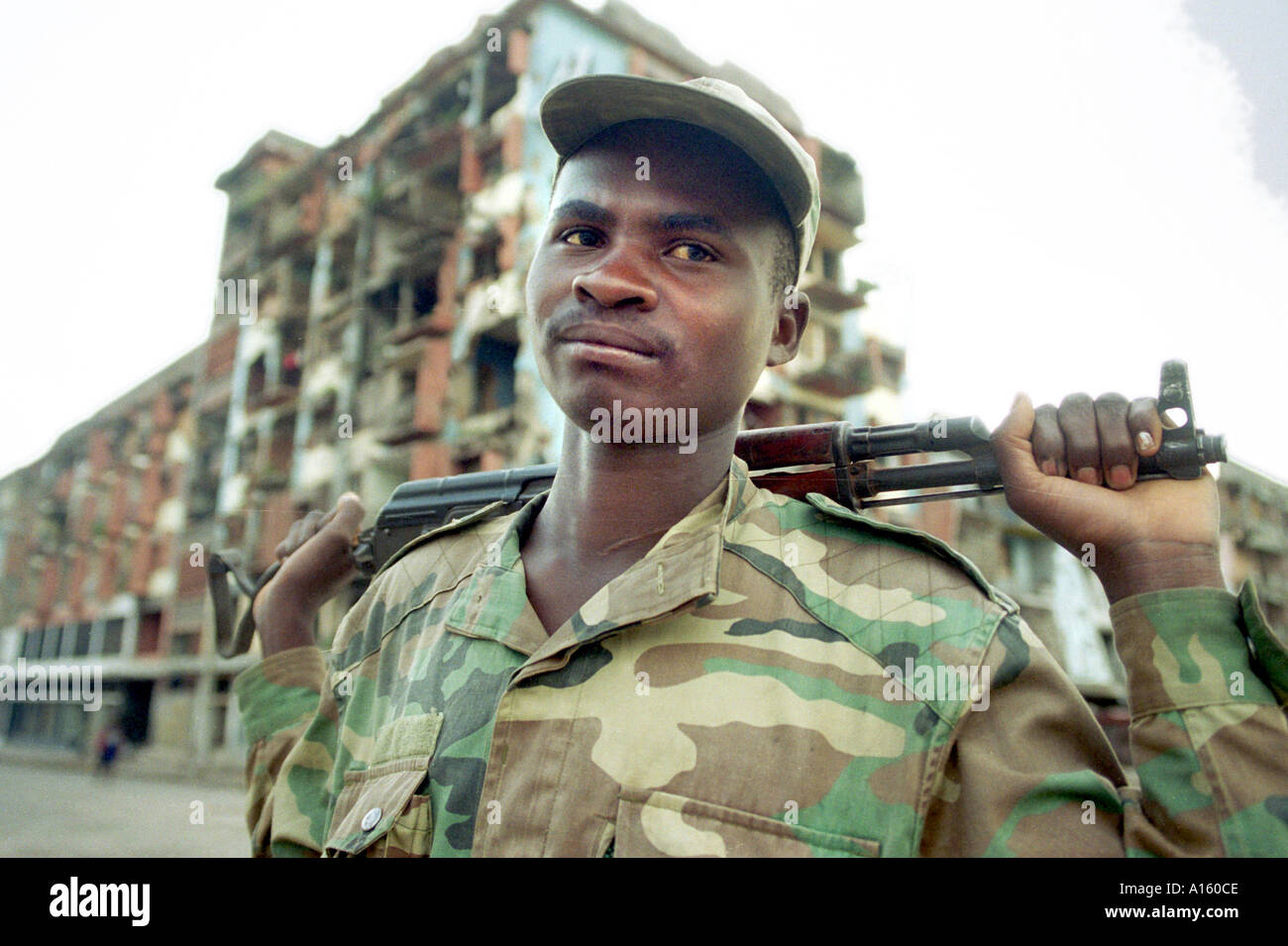 An Angolan soldier known as Bernardo stands in the center of a town in ...