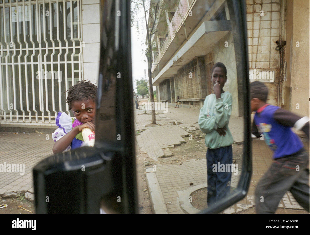 Angolan children play in one of the many destroyed buildings in the ...