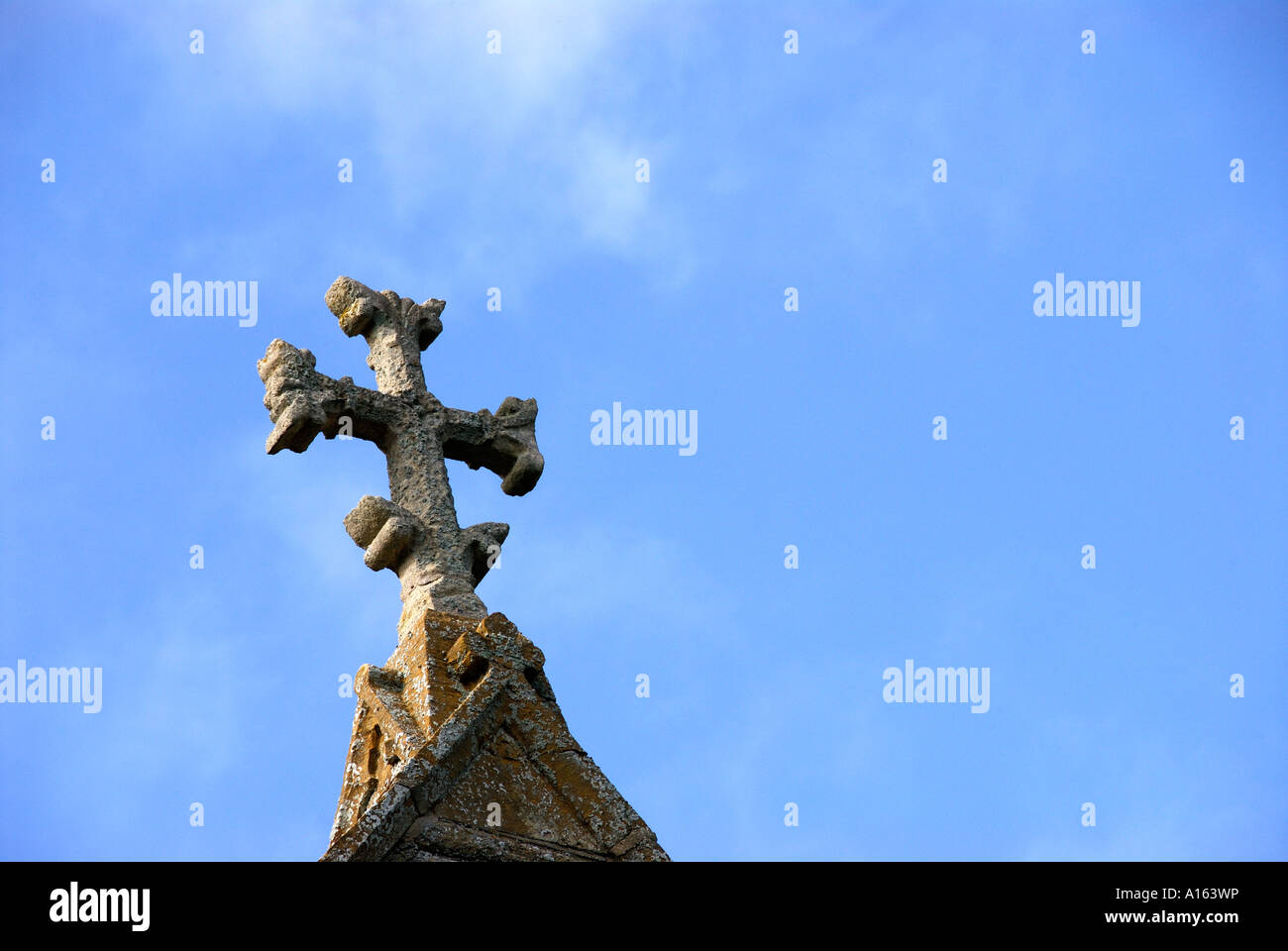 "Stone cross on church roof Stock Photo - Alamy