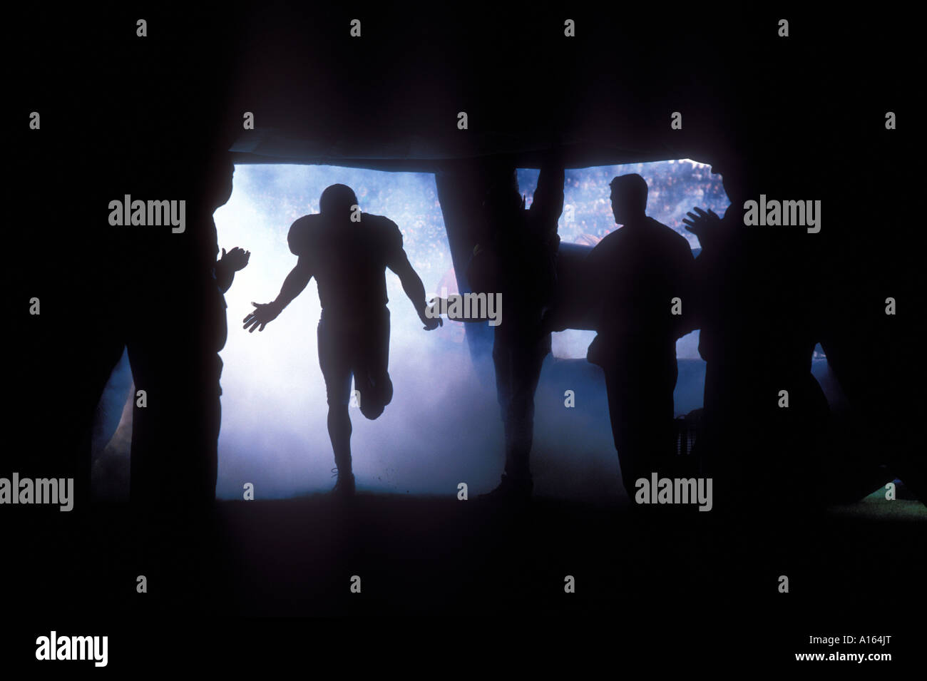Digital stock image of male American football player running out on to ...