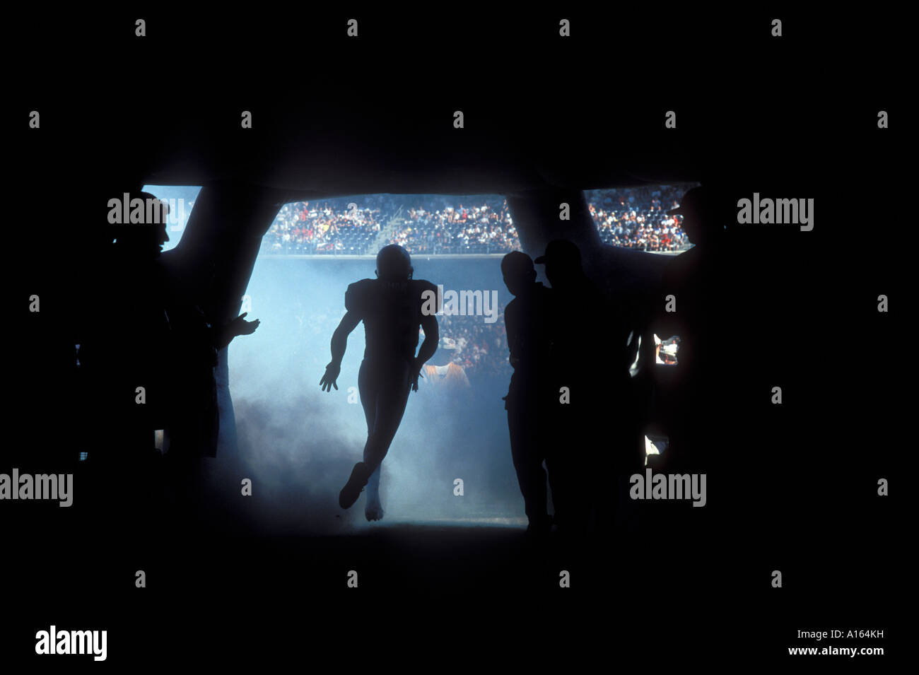 Digital stock image of male American football player running out on to ...