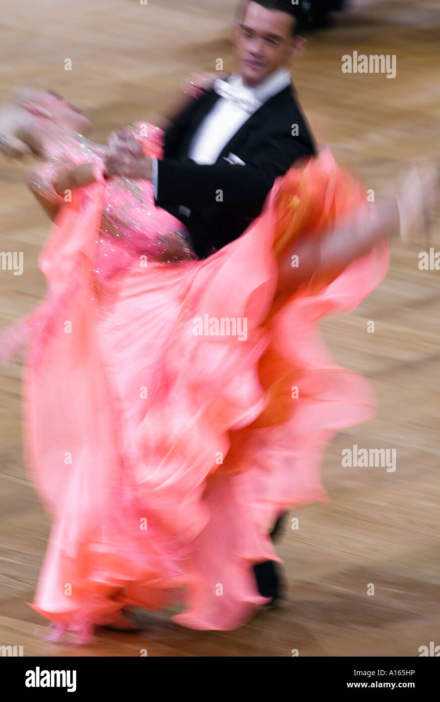 Professional ballroom dancers performing in the Standard Dance ...