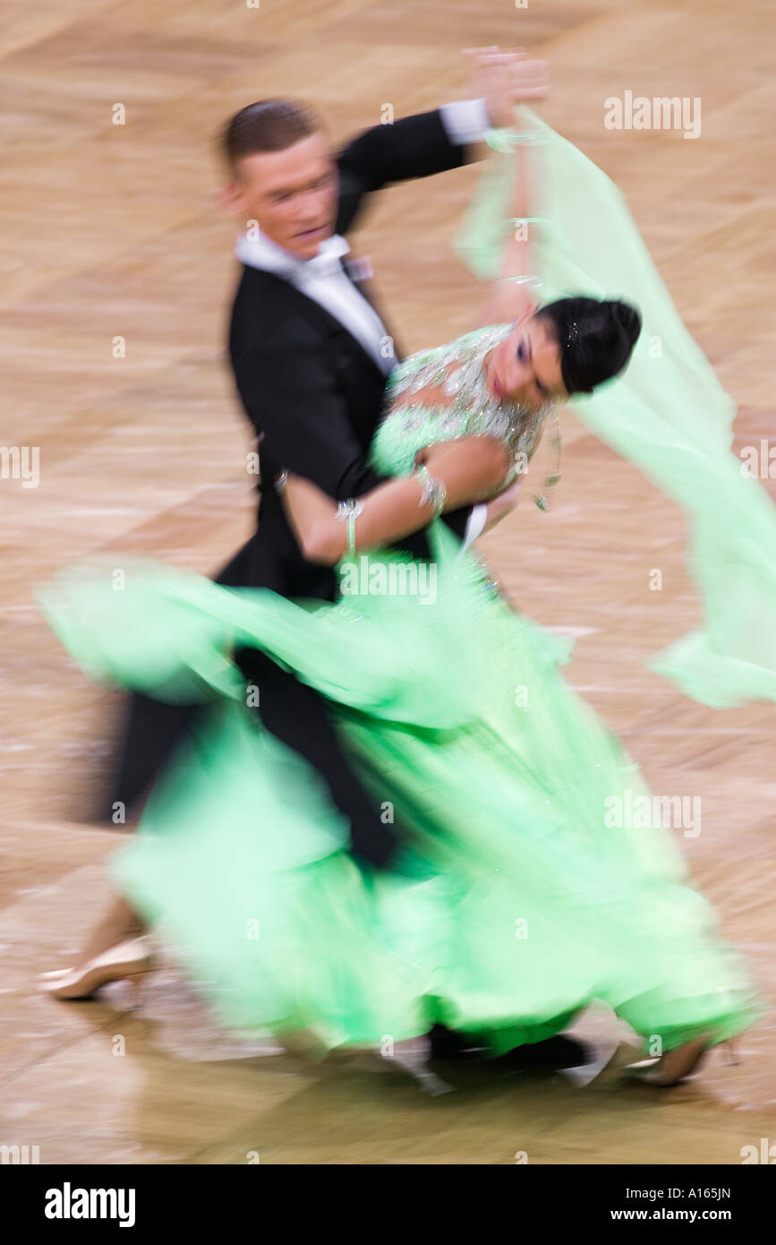 Professional ballroom dancers performing in the Standard Dance ...