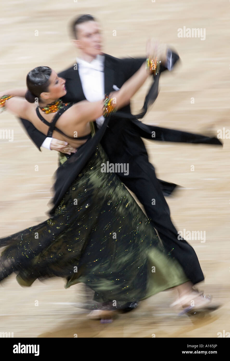 Professional ballroom dancers performing in the Standard Dance ...