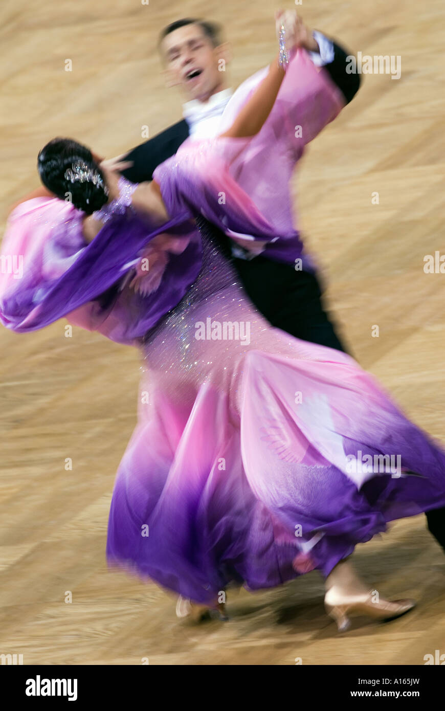 Professional ballroom dancers performing in the Standard Dance ...