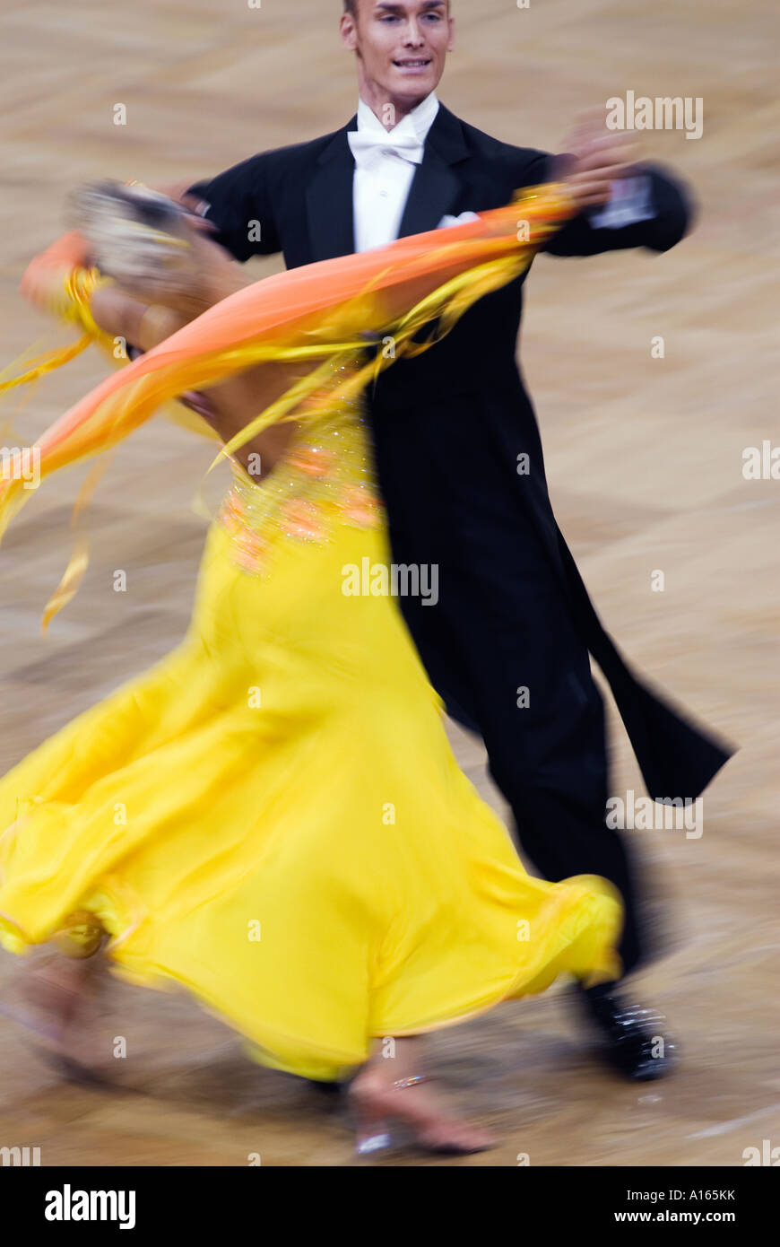 Professional ballroom dancers performing in the Standard Dance ...