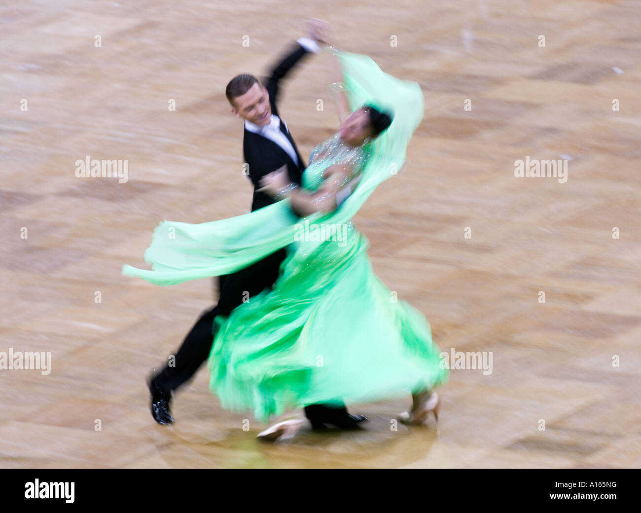 Professional ballroom dancers performing in the Standard Dance ...