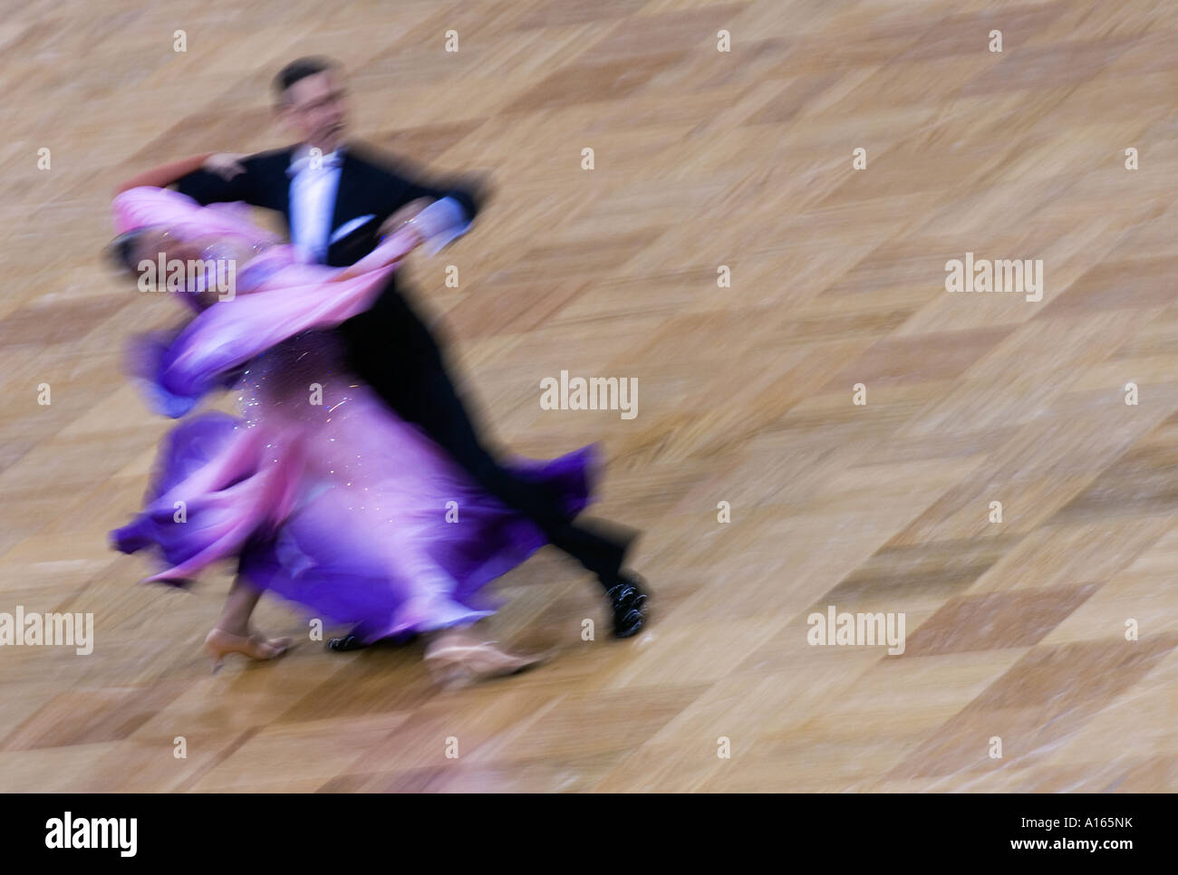 Professional ballroom dancers performing in the Standard Dance ...
