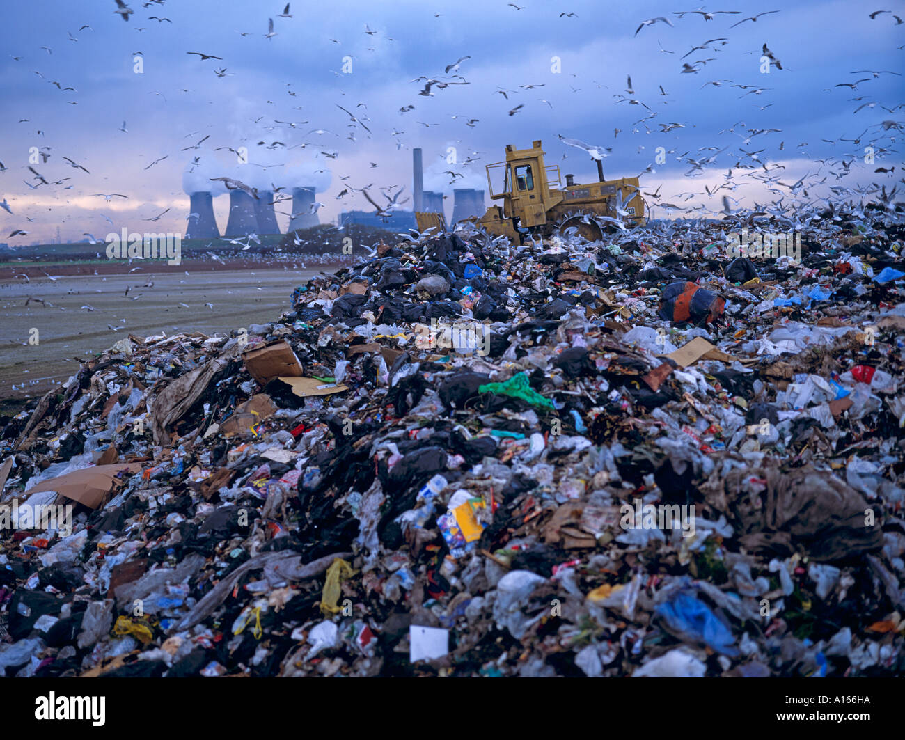 Bulldozing waste on land fill site Warrington Cheshire England UK Stock ...