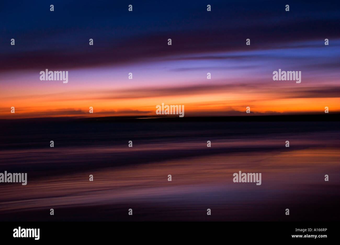 Abstract Beach at sunset Stock Photo - Alamy