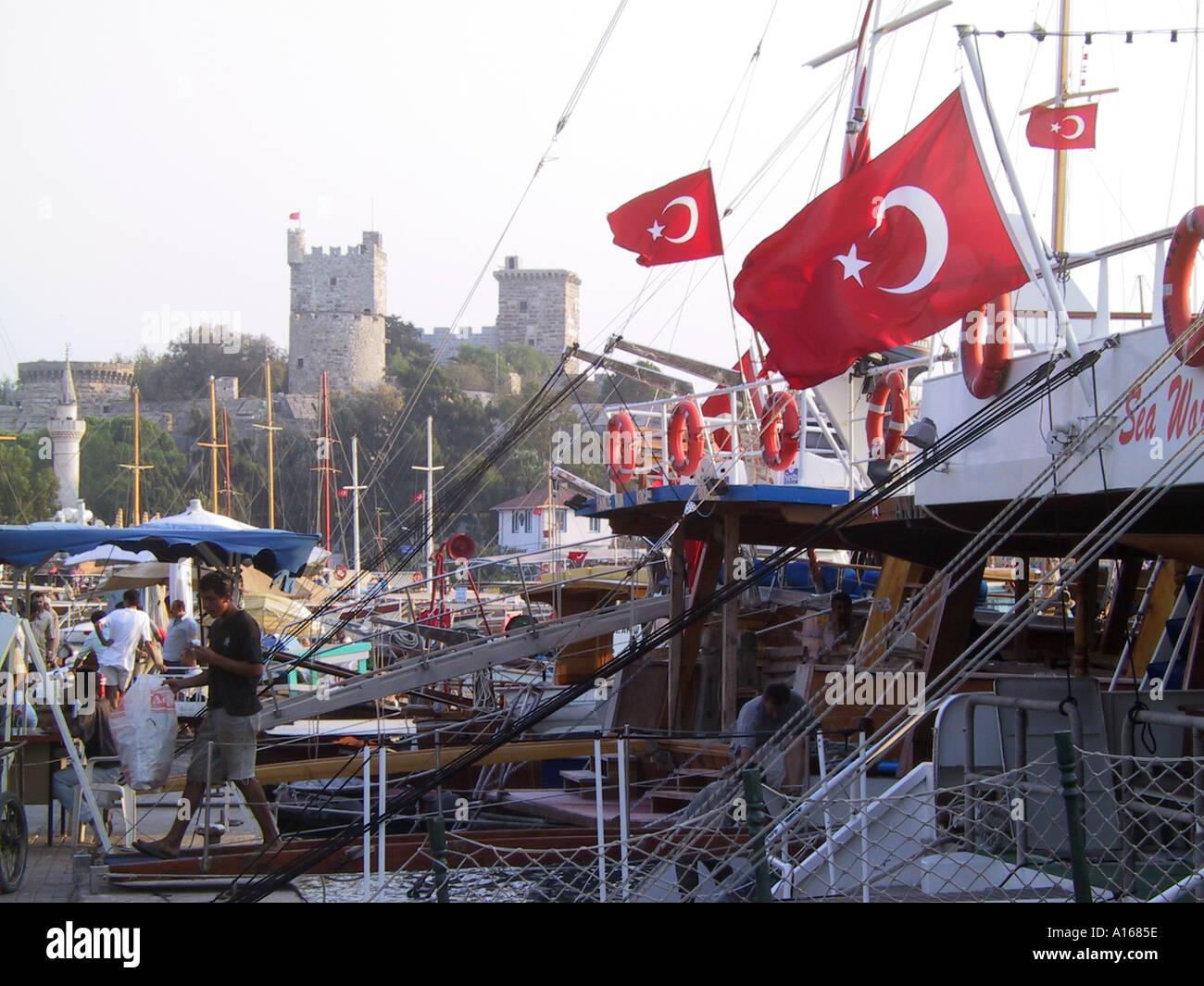 Turkish flags and the Bodrum Castle Bodrum Turkey Stock Photo - Alamy