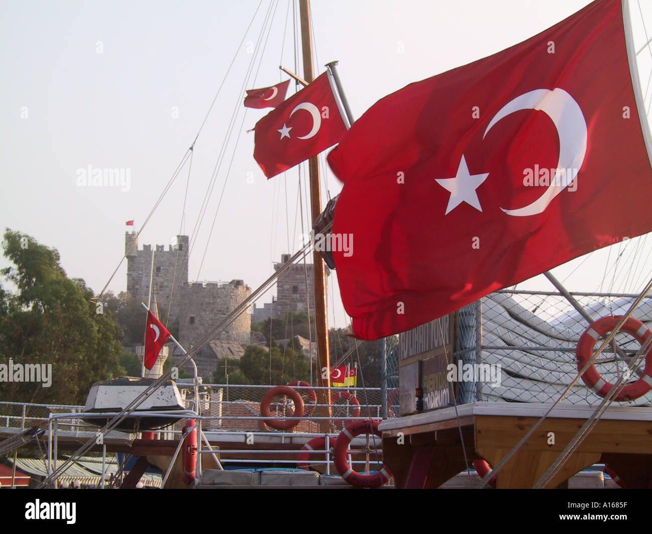 Turkish flags and the Bodrum Castle Bodrum Turkey Stock Photo - Alamy