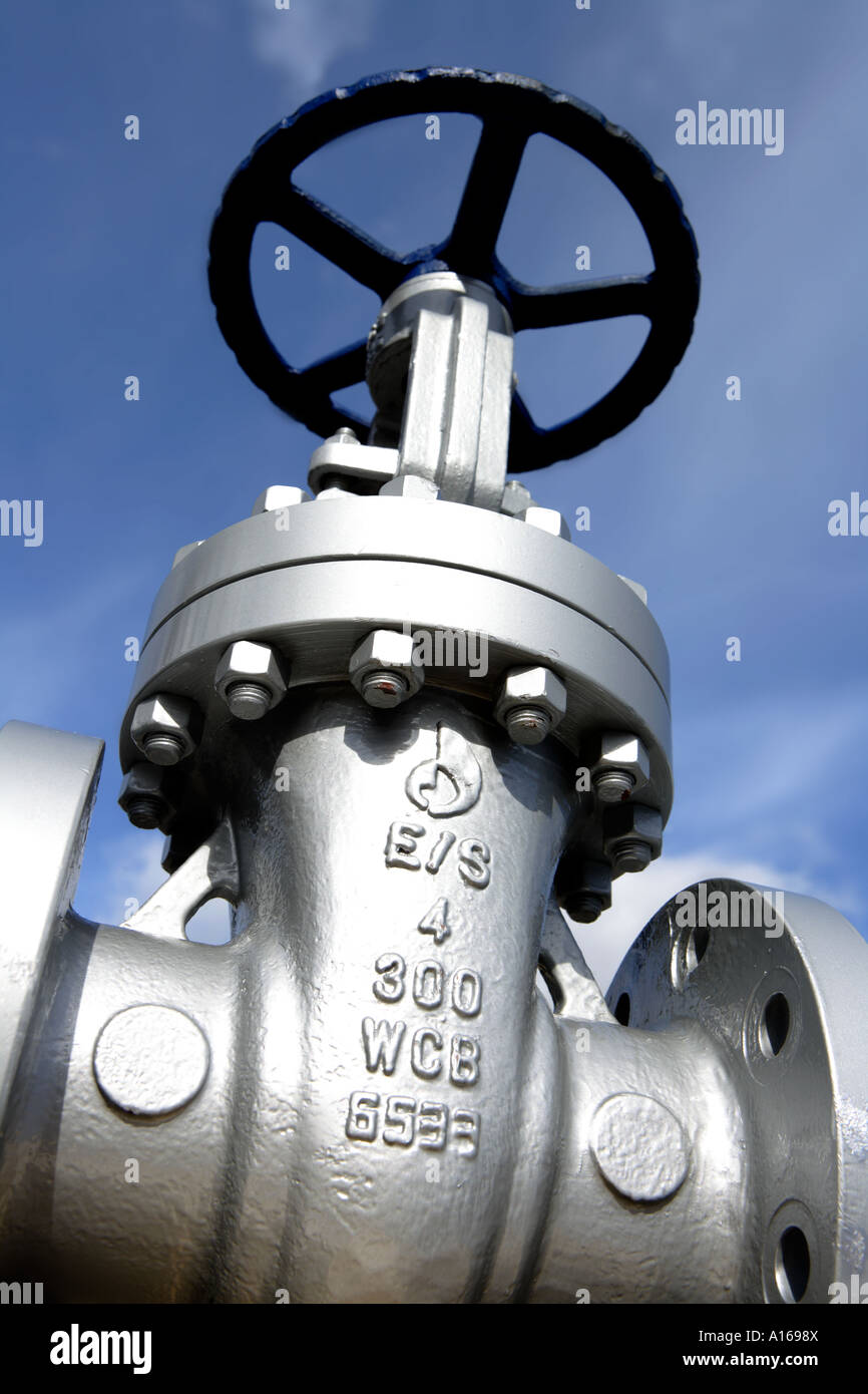 Silver Industrial in line shut off valve under blue sky, close up Stock ...