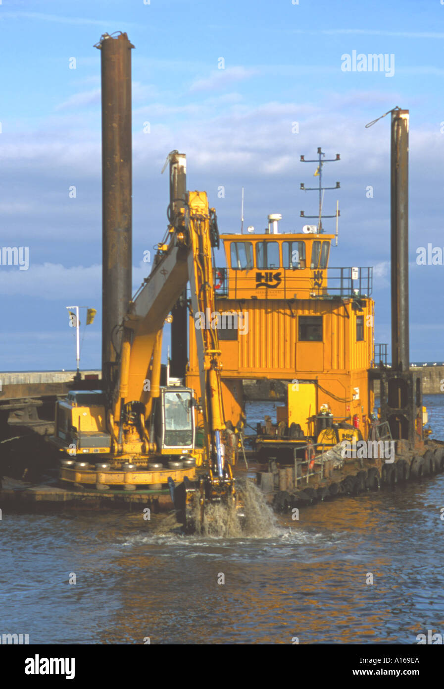 Dipper dredger in action, Amble Harbour, Northumberland, England, UK ...