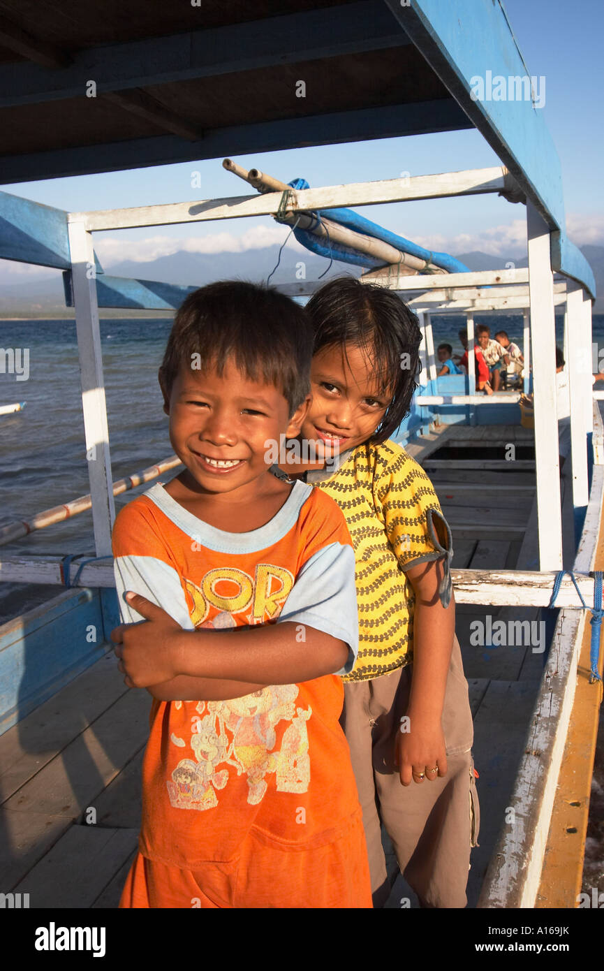 Boy And Girl Posing On Boat, Gili Air Stock Photo - Alamy