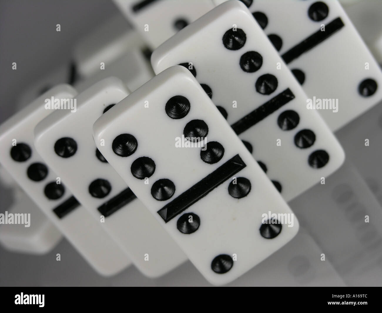 Dominoes in a row Stock Photo - Alamy